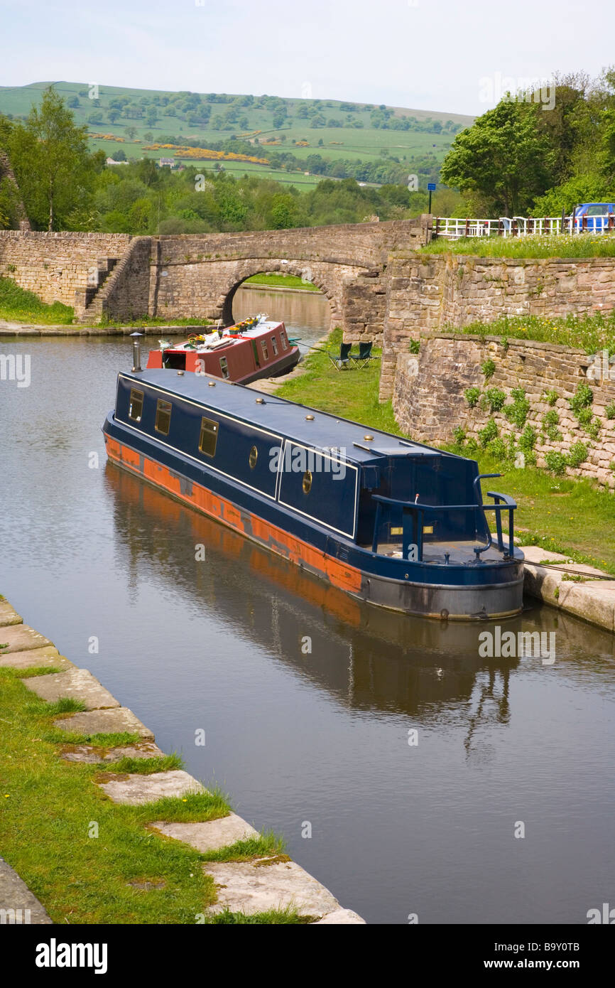A view of Narrow Boats moored on the Peak Forest Canal at Bugsworth ...