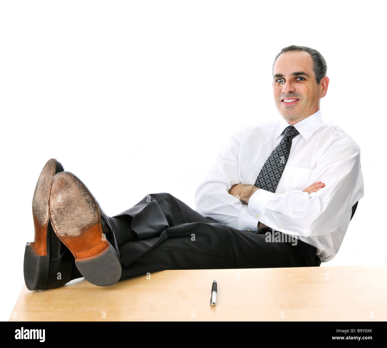 Boss smiling feet on desk hi-res stock photography and images - Alamy