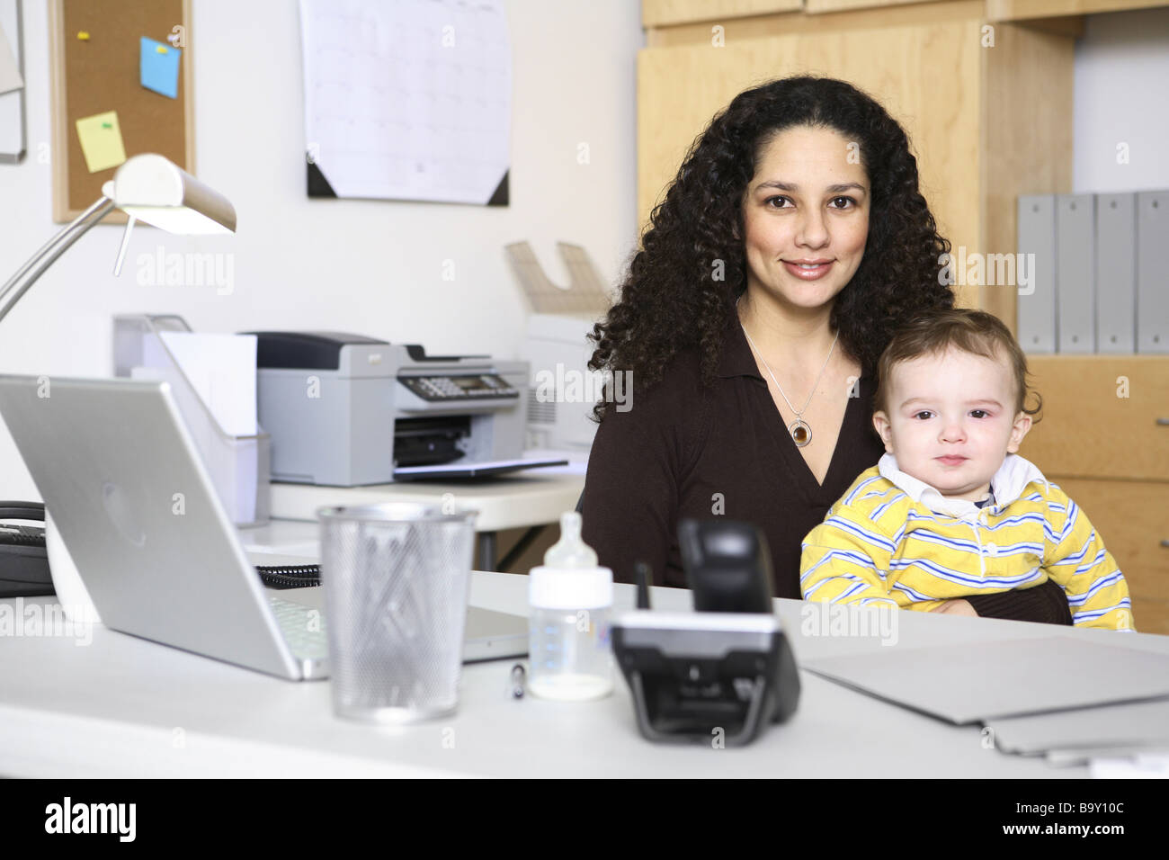 Child in work office hi-res stock photography and images - Alamy