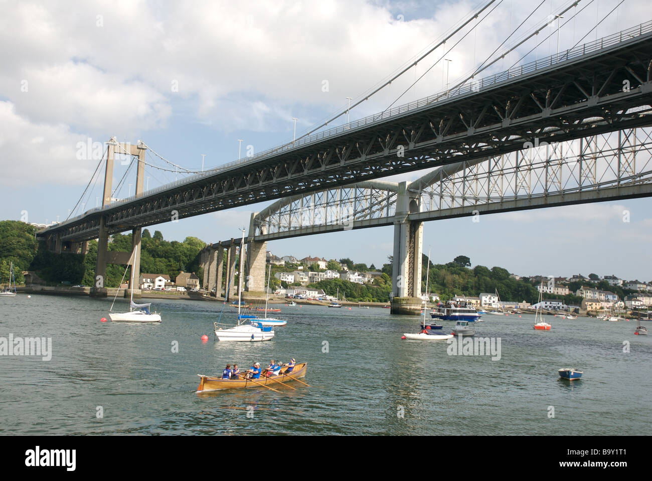 Gig boat racing below the Tamar Bridge and Brunel's Royal Albert Bridge ...