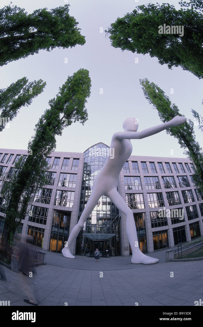 Walking man sculpture munich germany hi-res stock photography and ...
