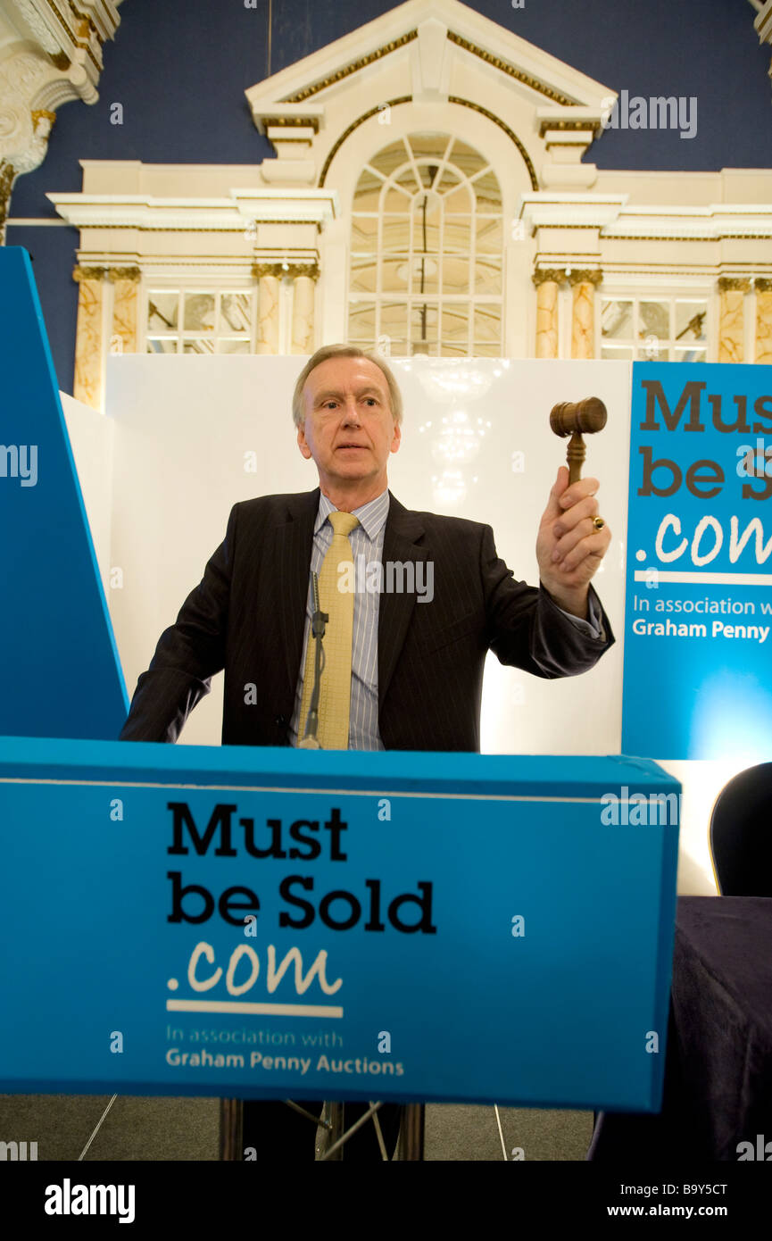 AUCTIONEER GRAHAM PENNY, DURING PROPERTY AUCTION ORGANISED BY ...