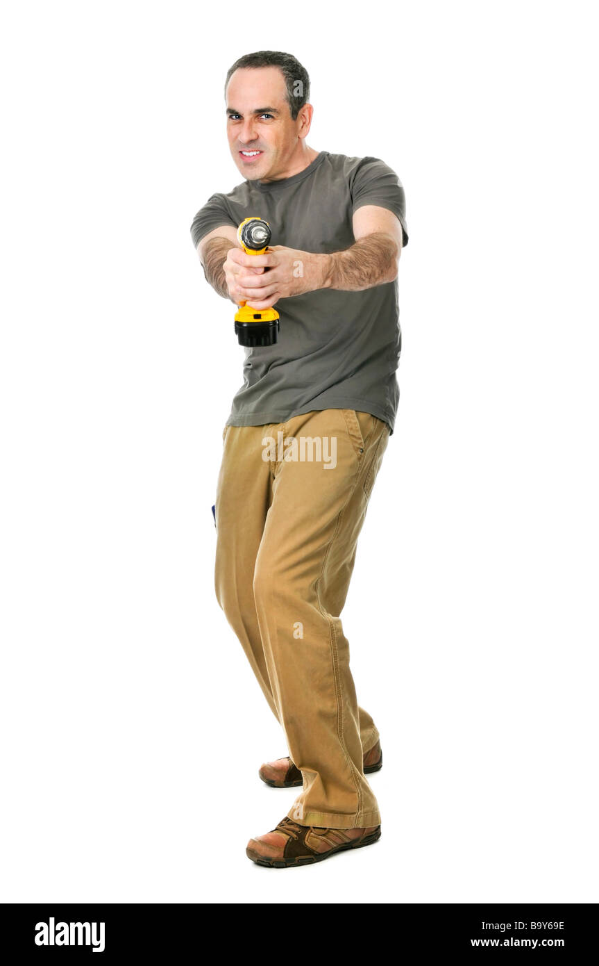 Fierce handyman aiming his cordless drill like a gun Stock Photo - Alamy