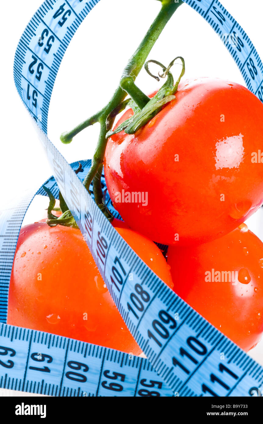tomato with a measuring tape Stock Photo - Alamy