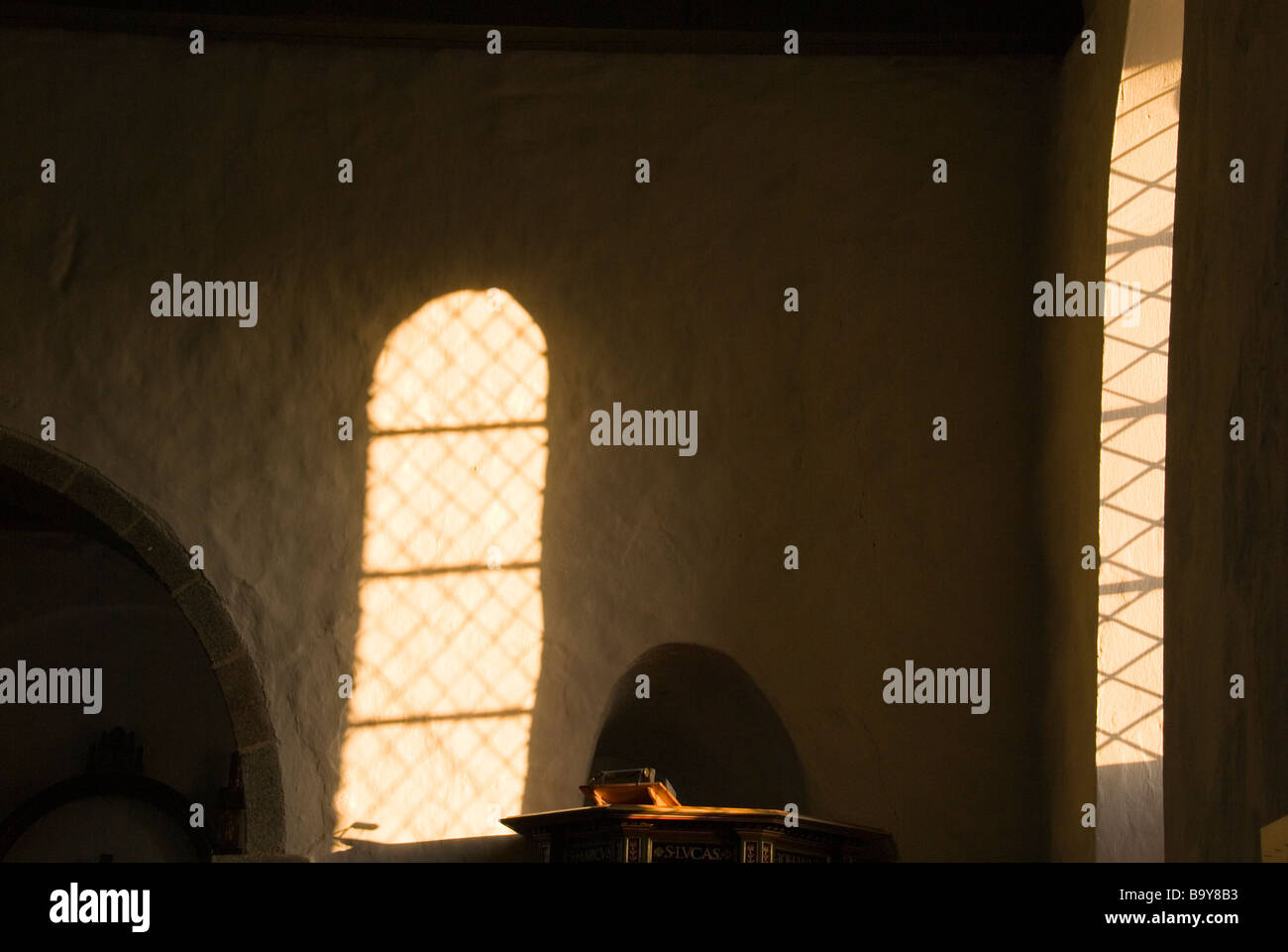 Pulpit in church with golden evening light making copy of window at the ...