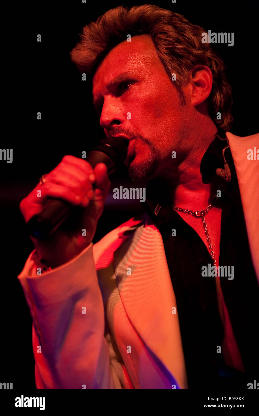 Singer with a mic. Singer looks like Johnny Hallyday Stock Photo - Alamy