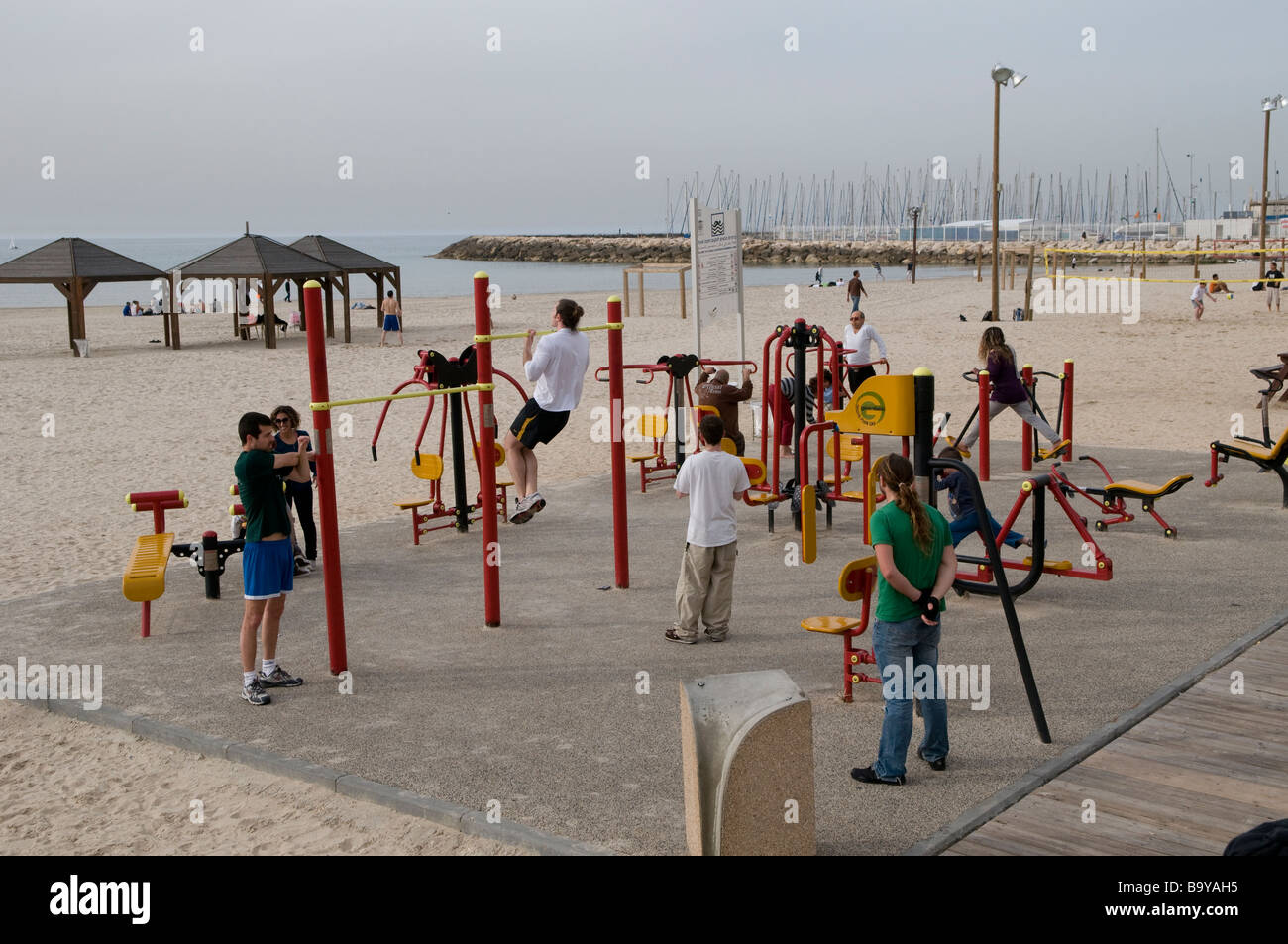 People exercising in a gymnastic playground in Gordon beach at the ...