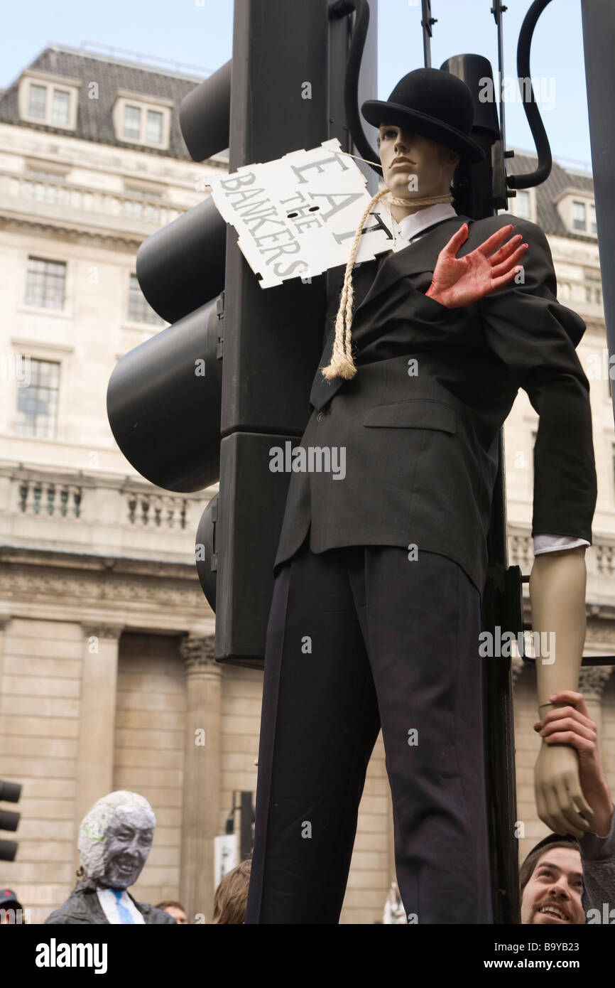 A dummy dressed up as a fat cat banker suspended from a lamp post after ...