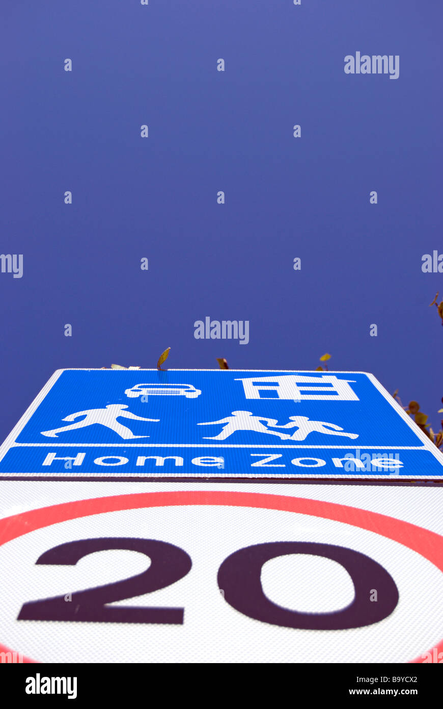 home zone traffic sign with speed limit sign in a british residential ...