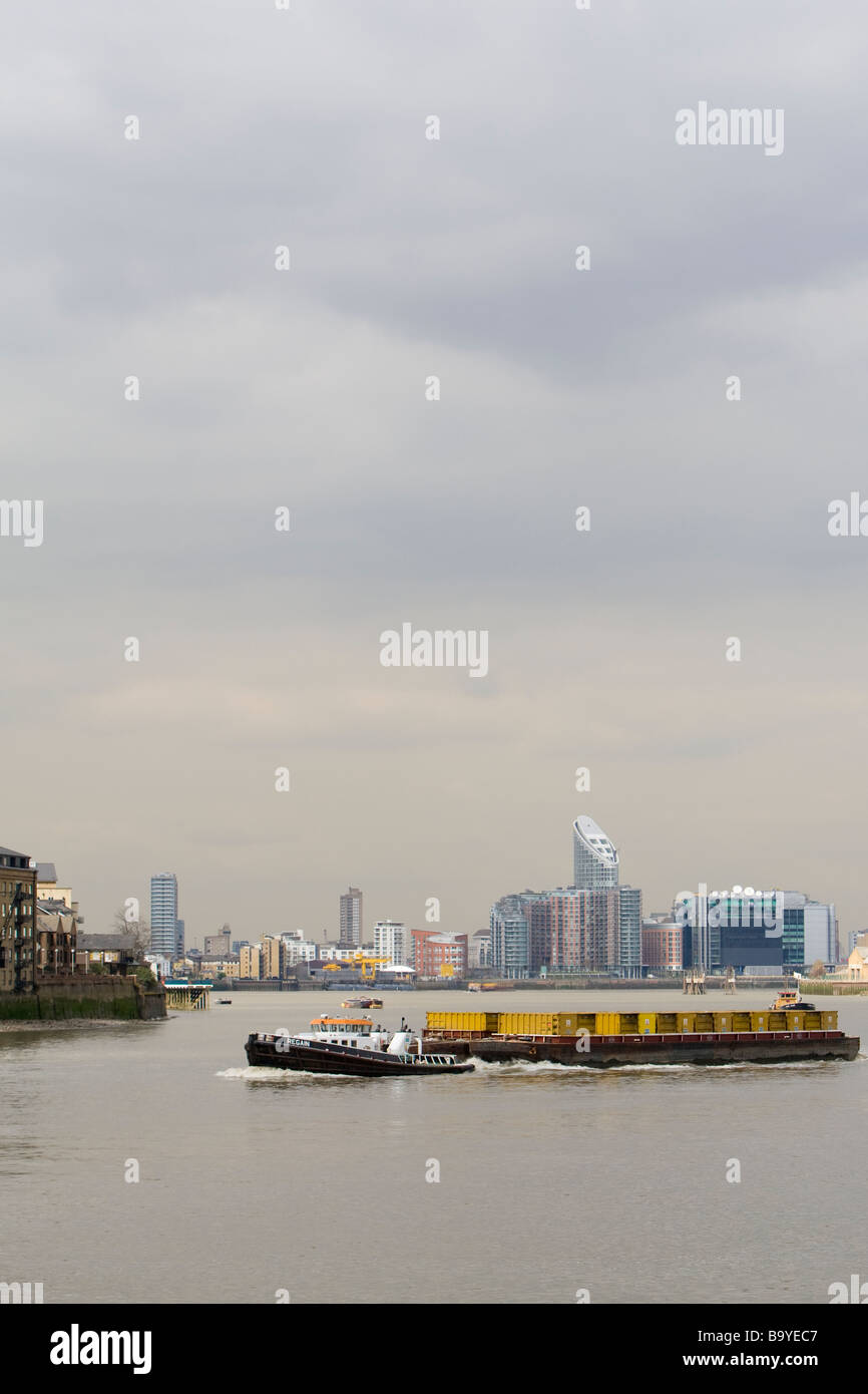 River Thames with tug and barges used for transporting London's waste ...