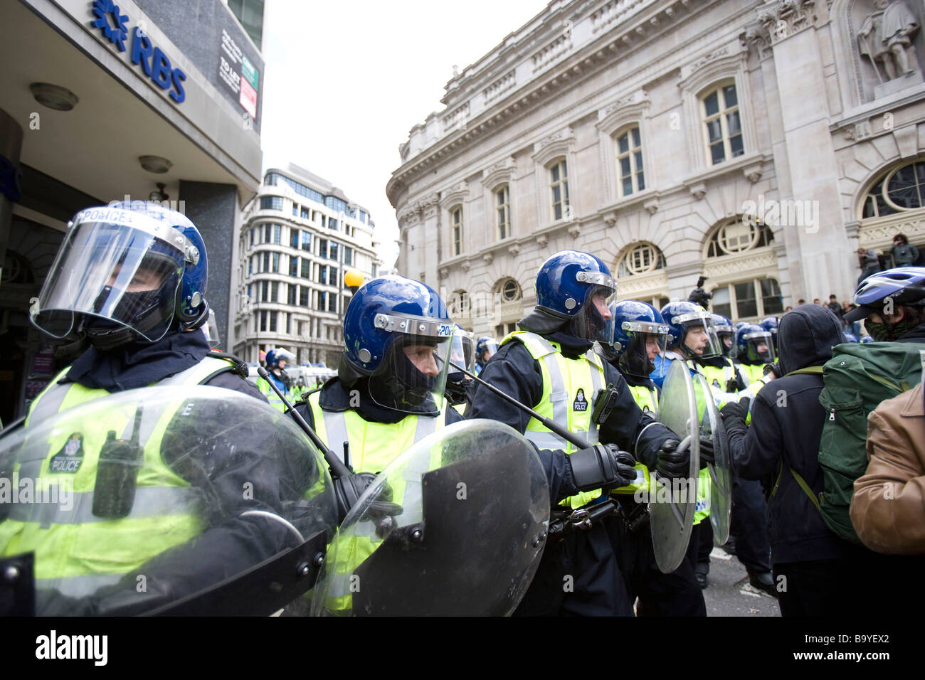 Riot police protect RBS bank in the city next to the Bank of England ...
