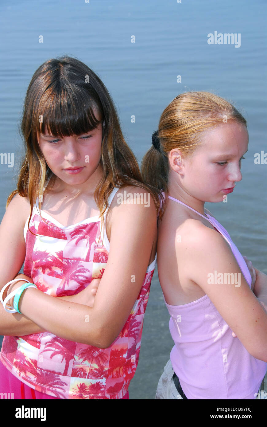 Two preteen girls pouting Stock Photo - Alamy