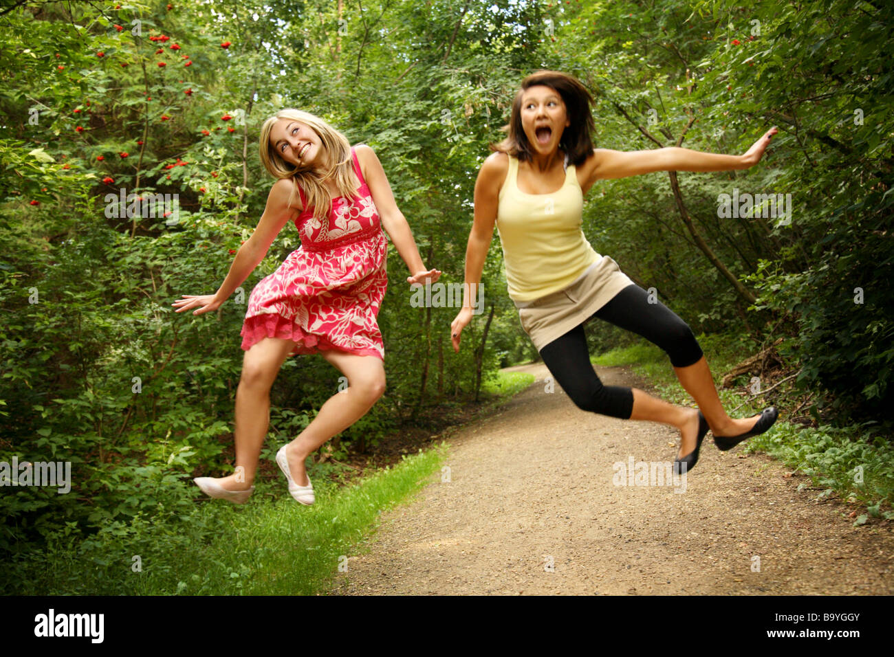 Energetic girl jumping mid air hi-res stock photography and images - Alamy