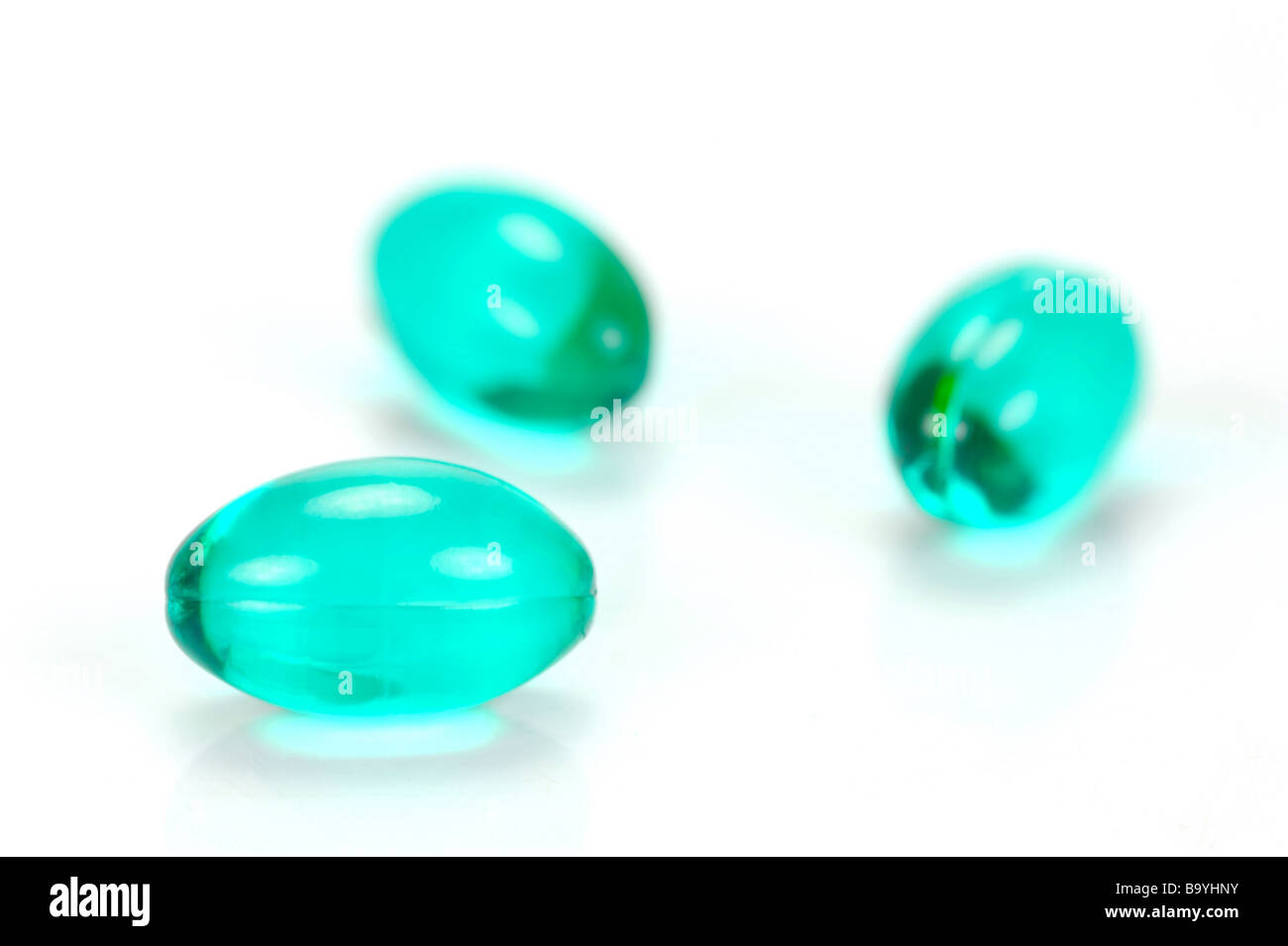 Headache Capsules isolated against a white background Stock Photo - Alamy