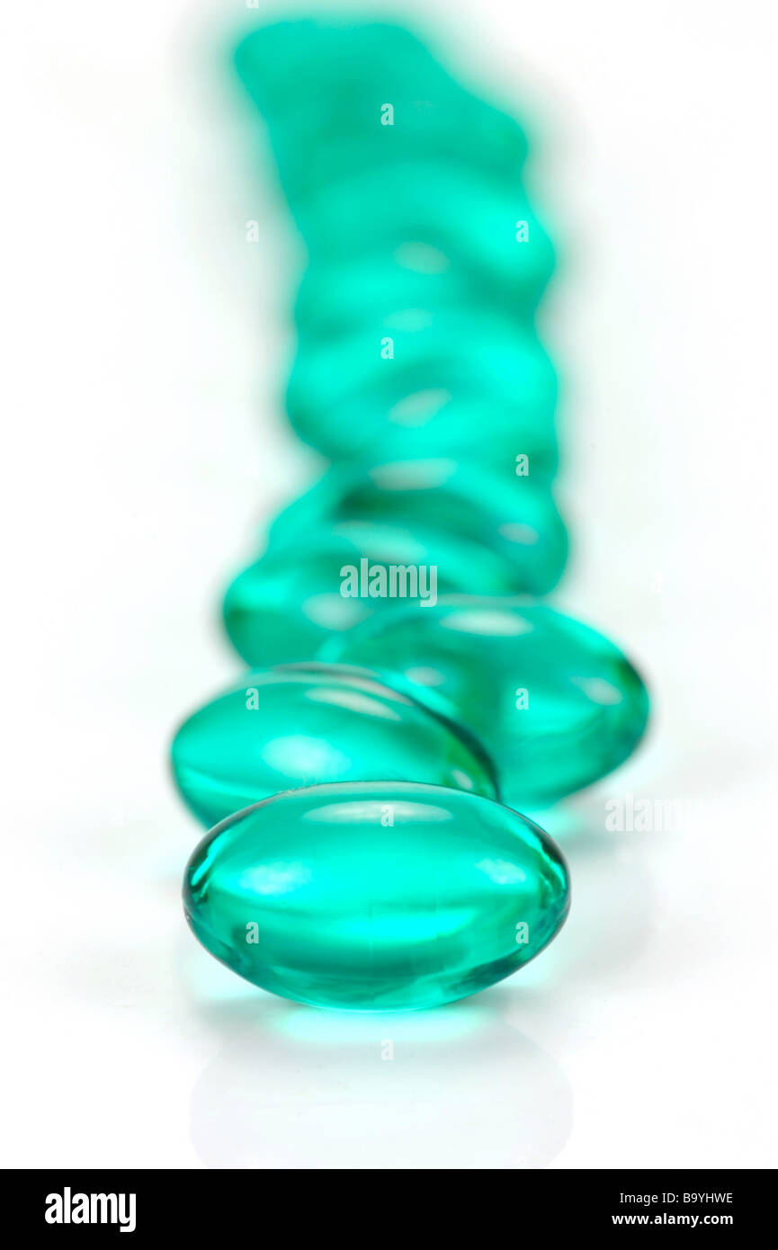 Headache Capsules isolated against a white background Stock Photo - Alamy