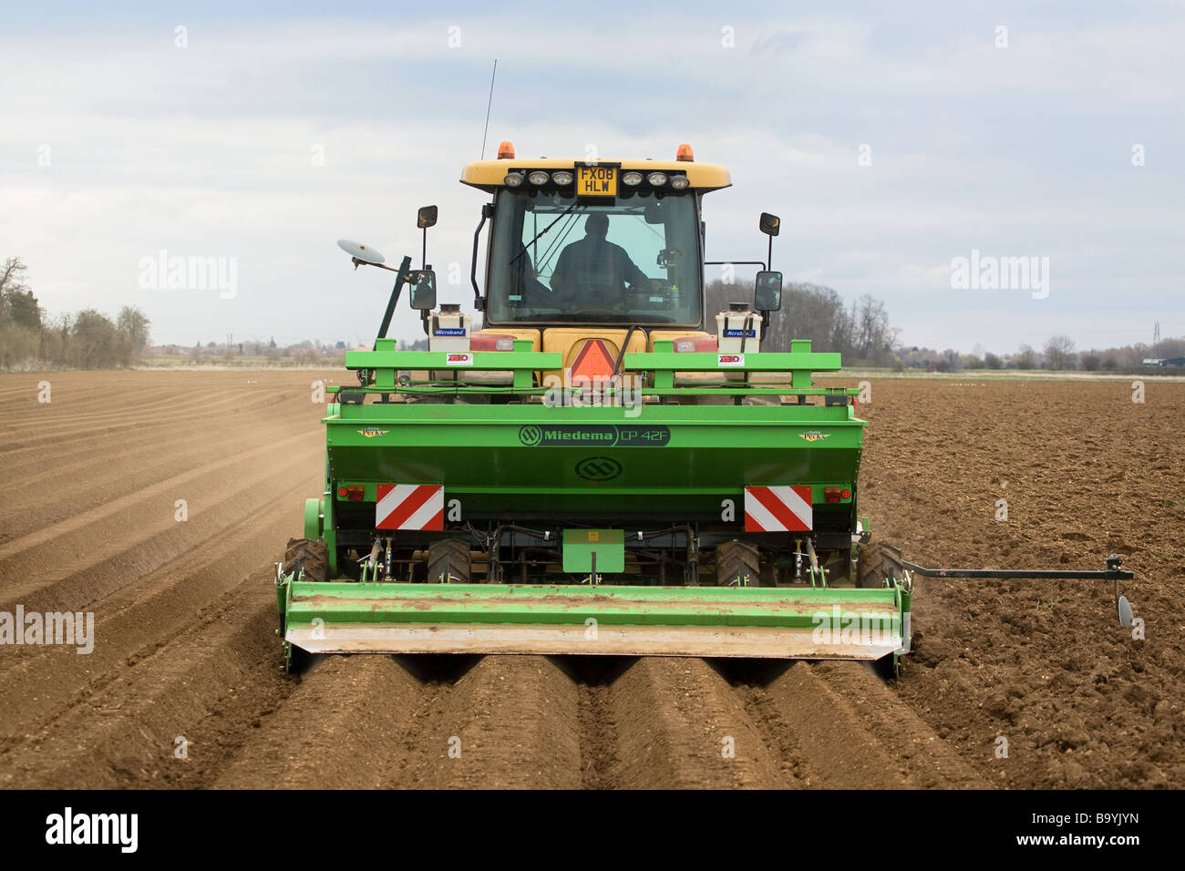 Tractor planting potatoes hi-res stock photography and images - Alamy