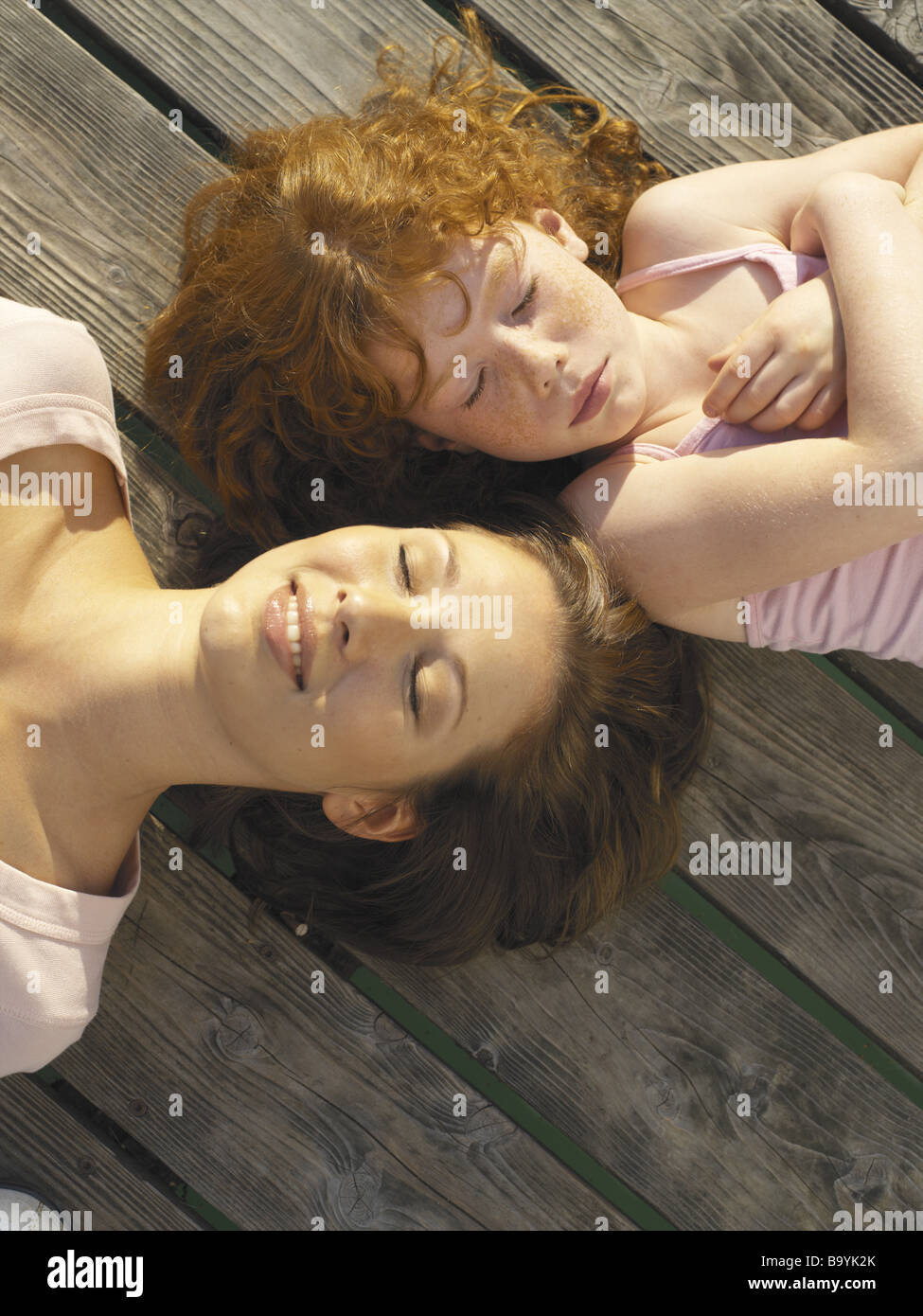 Girl lying on back sunbathing hi-res stock photography and images - Alamy