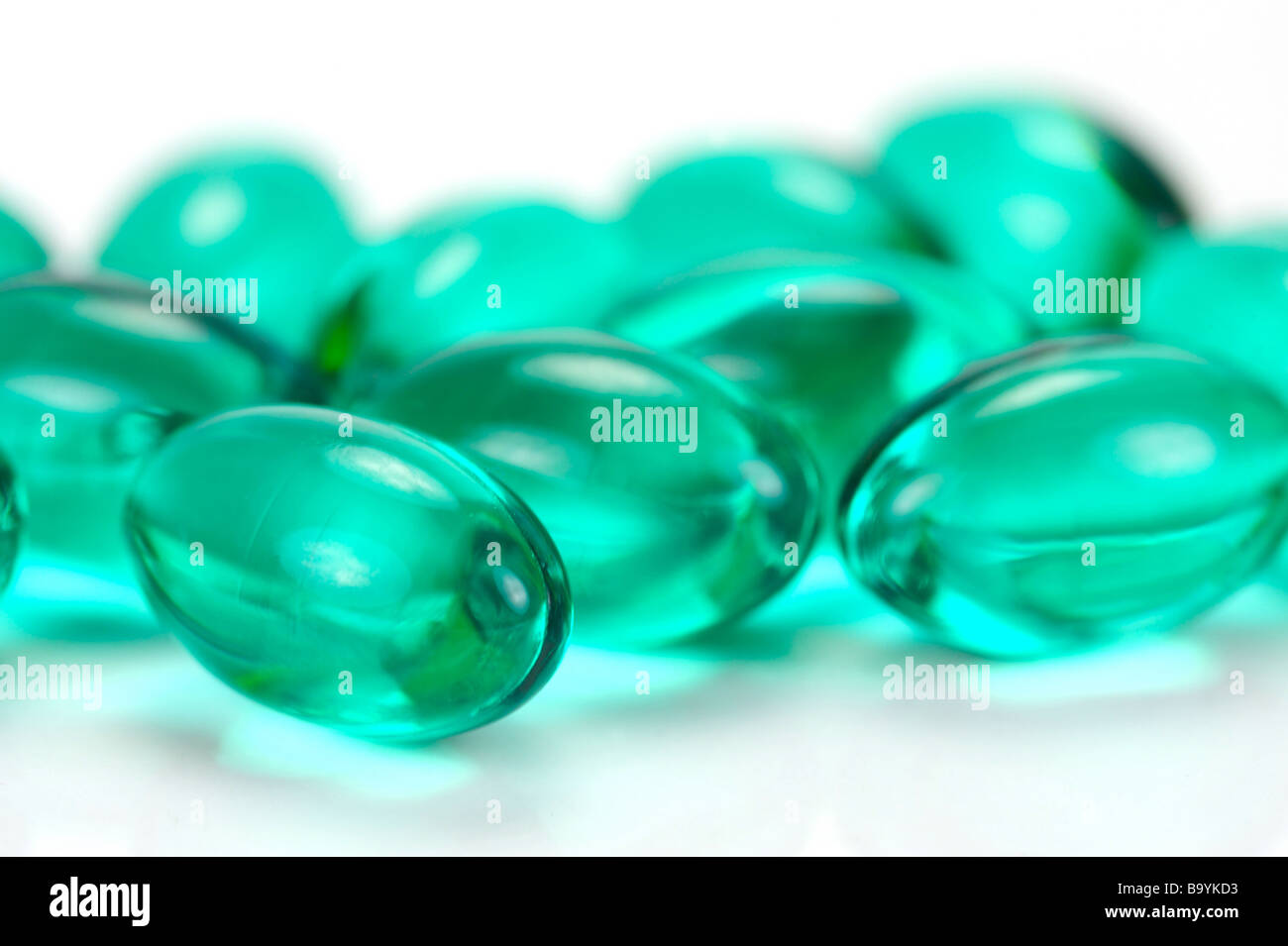 Headache Capsules isolated against a white background Stock Photo - Alamy