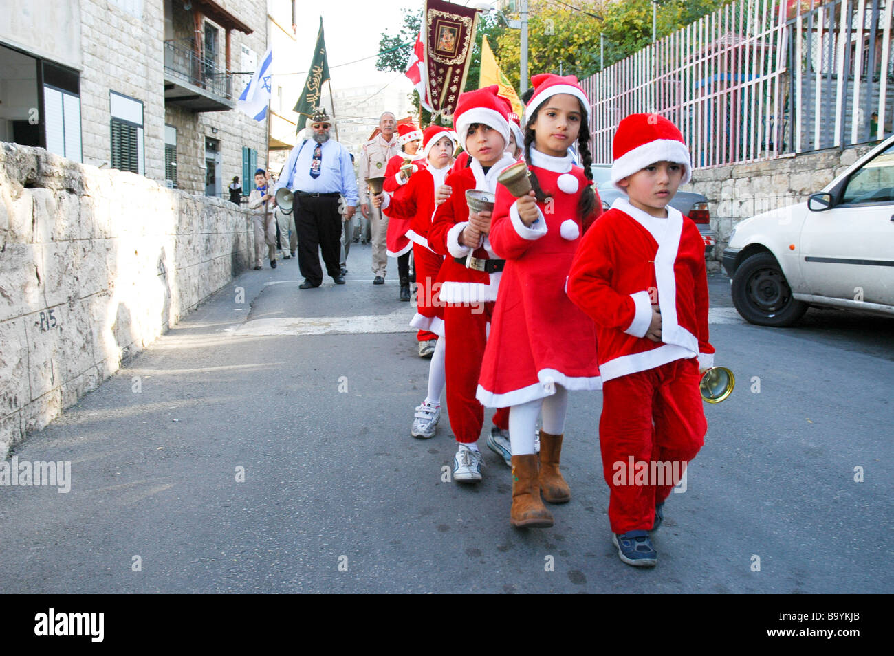 Children dressed up as Santa Claus in a parade Stock Photo - Alamy