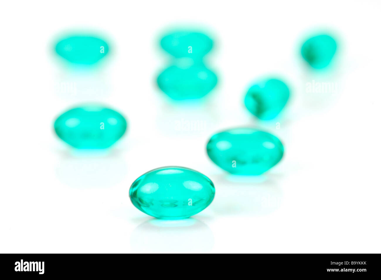 Headache Capsules isolated against a white background Stock Photo - Alamy