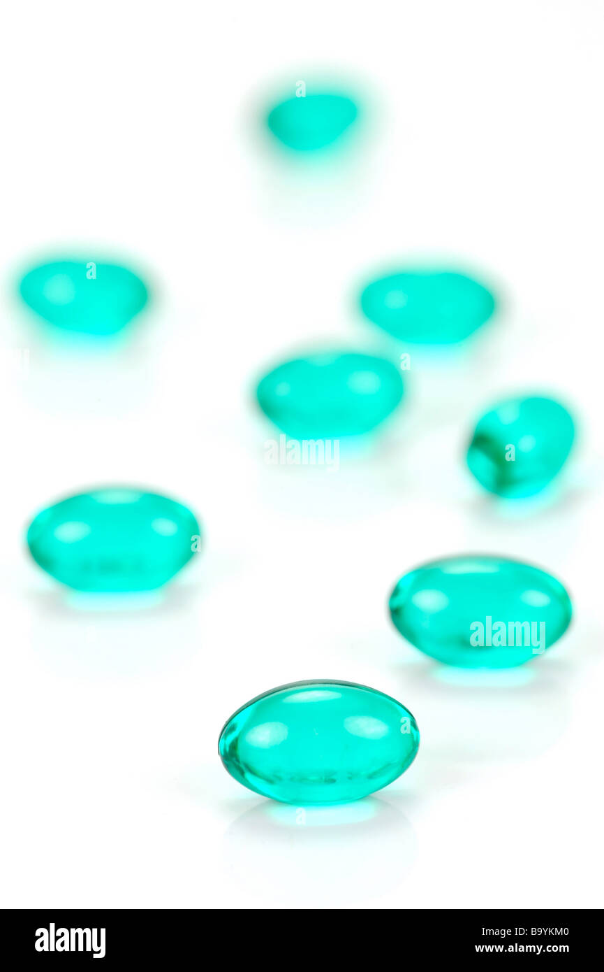 Headache Capsules isolated against a white background Stock Photo - Alamy