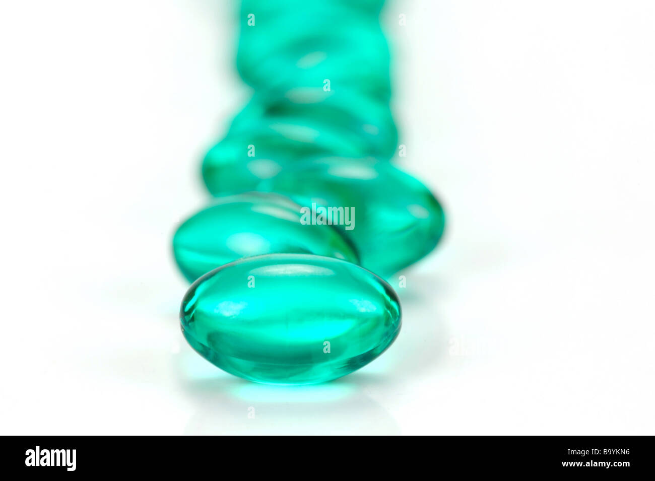 Headache Capsules isolated against a white background Stock Photo - Alamy