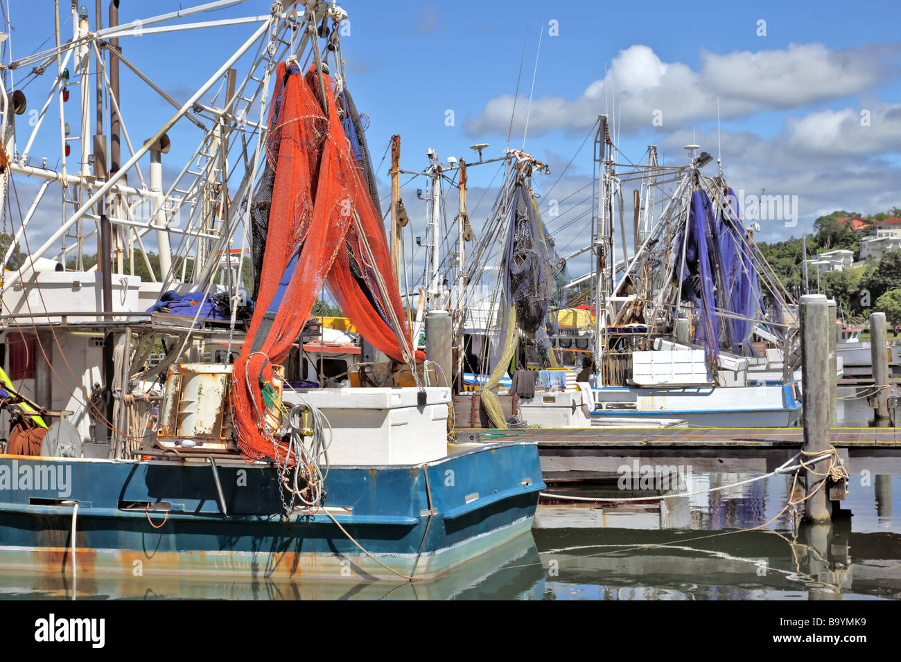Fishing trawlers back from the catch moored and drying their nets Stock ...