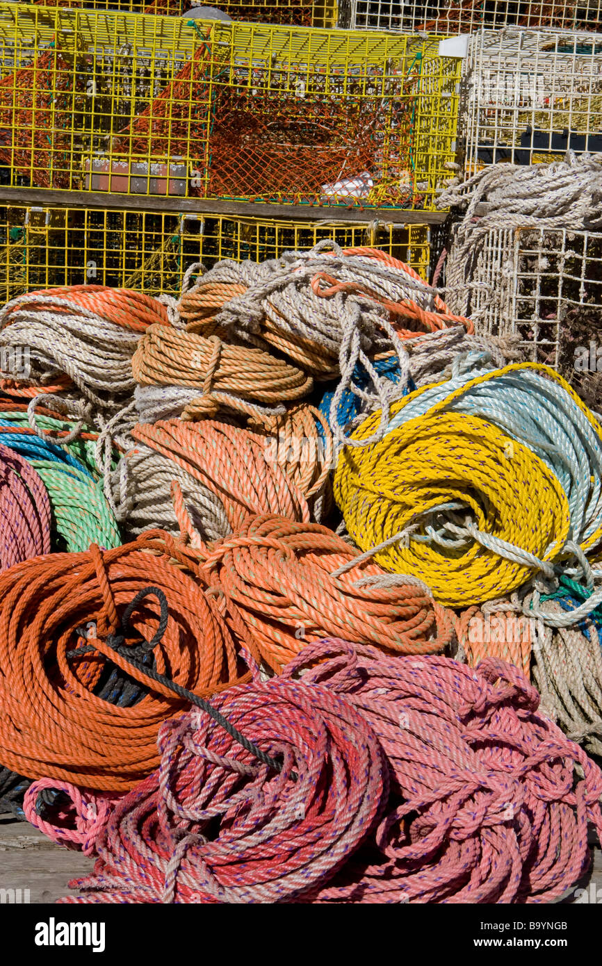 Lobster traps buoys and rope coils on a dock in coastal Maine Stock ...