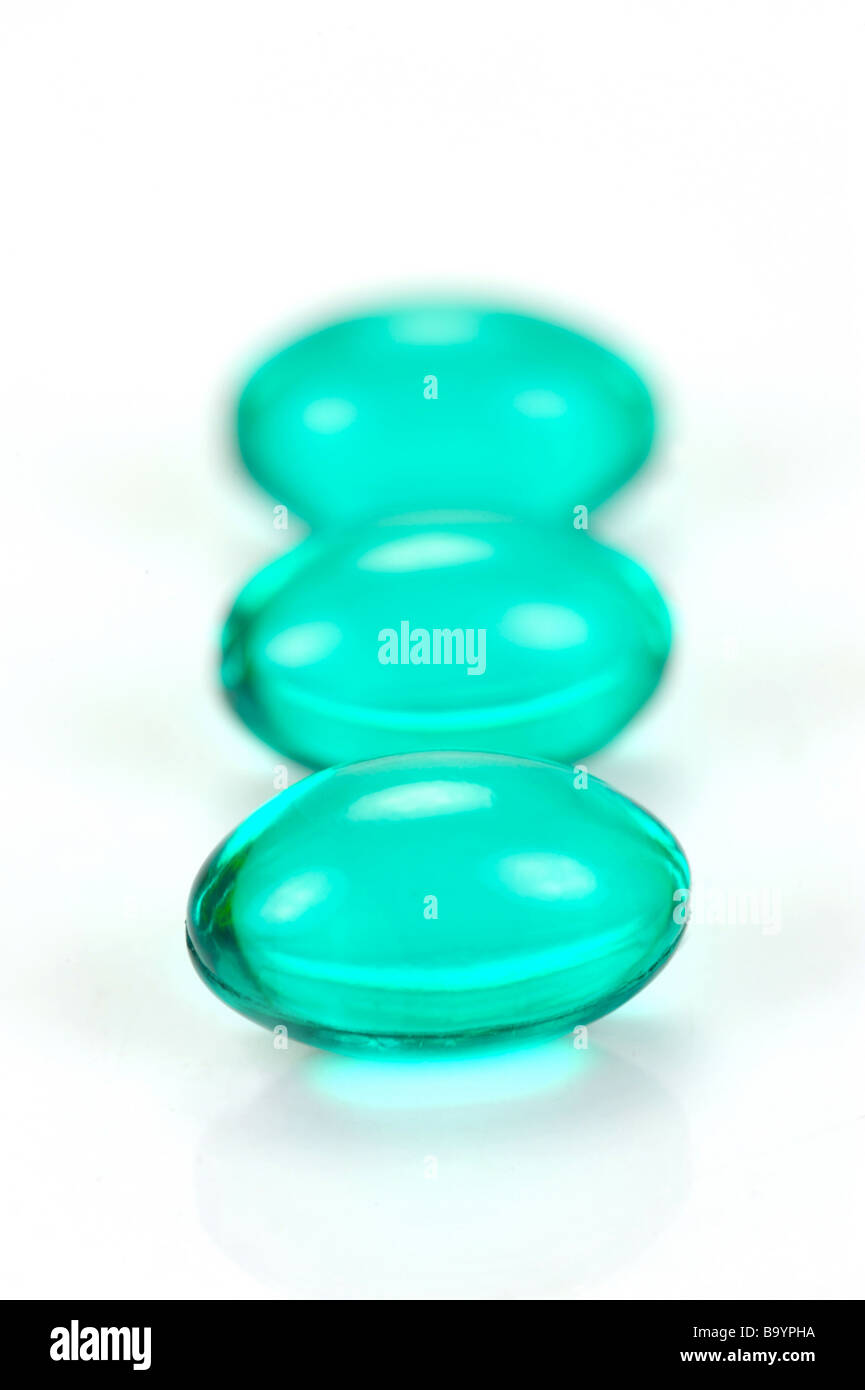 Headache Capsules isolated against a white background Stock Photo - Alamy