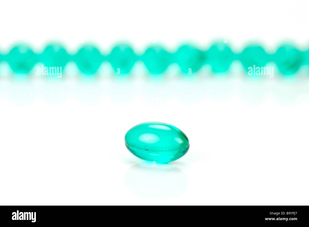 Headache Capsules isolated against a white background Stock Photo - Alamy