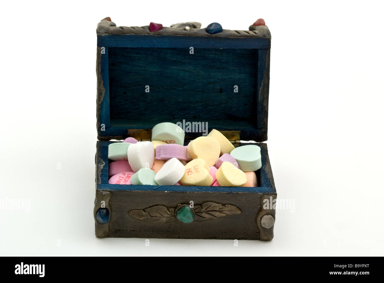 Small wooden treasure chest filled with heart shaped candies Stock ...