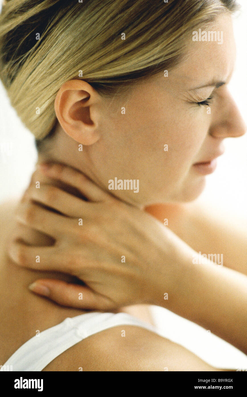 Woman massages painful hands hi-res stock photography and images - Alamy