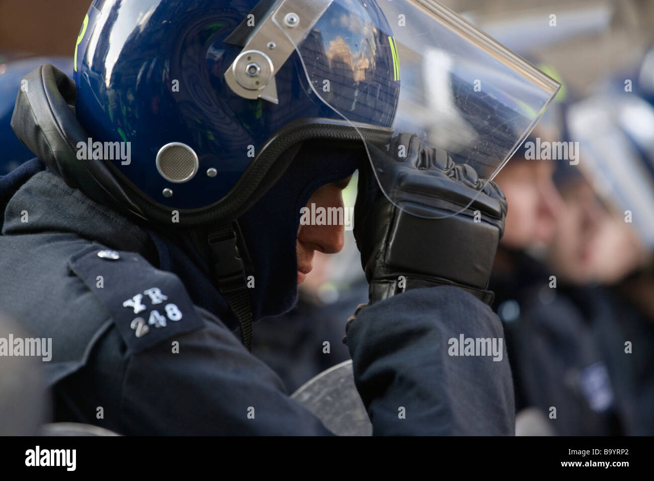 Police officer in riot gear during anti-capitalist protest against G20 ...
