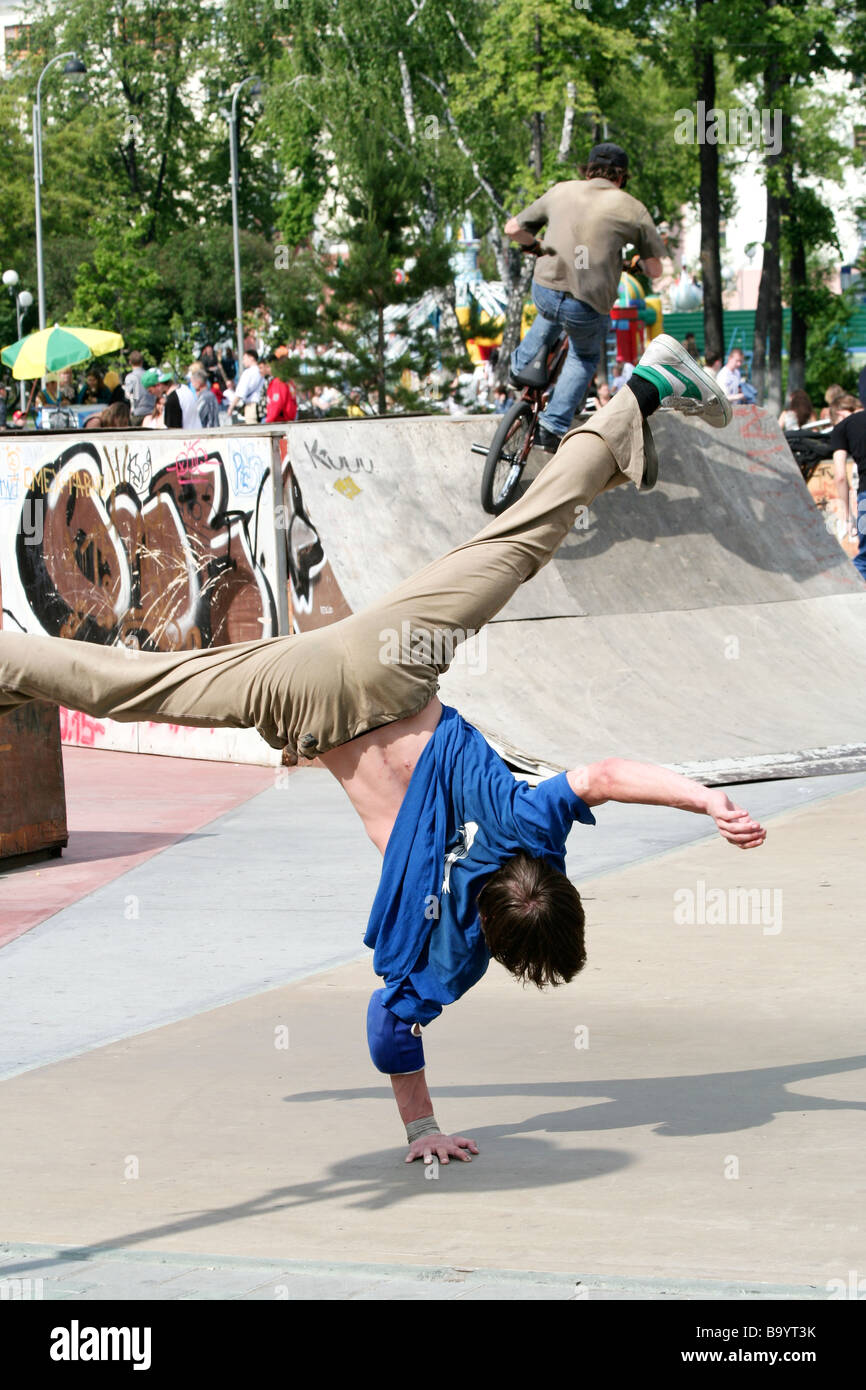 Young breakdancer standing on one hand Stock Photo - Alamy