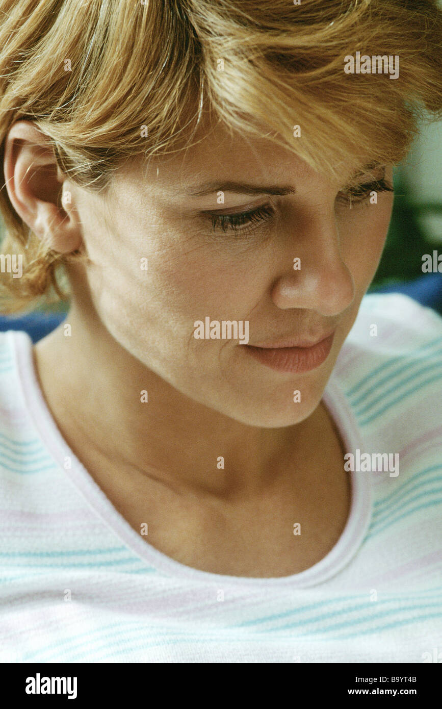 Woman looking down, portrait Stock Photo - Alamy