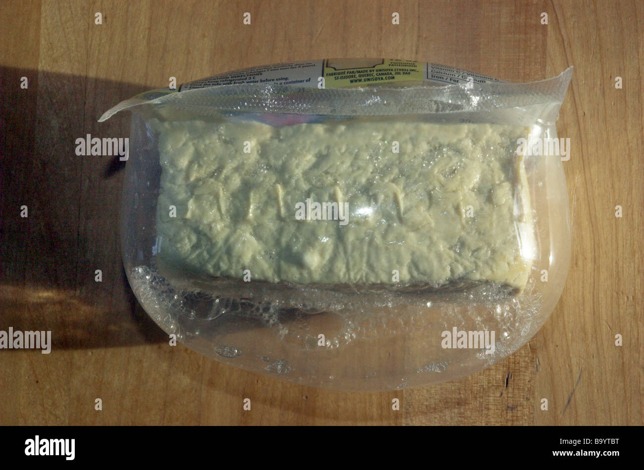 Bad tofu that has inflated its own packet Stock Photo - Alamy