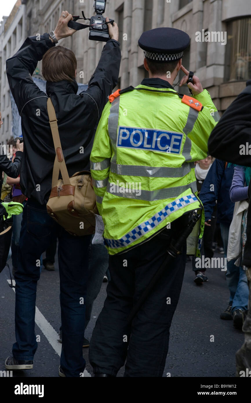 Press photographer covering London anti-G20 protest Stock Photo - Alamy