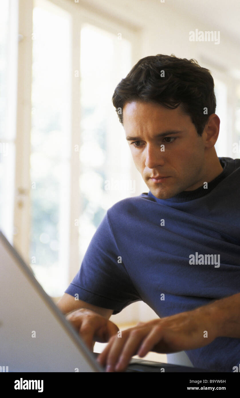 Man typing on laptop Stock Photo - Alamy