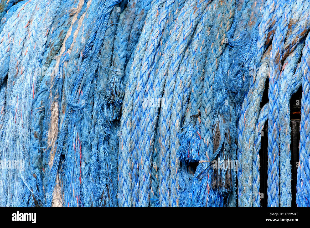 Bright blue rope coiled on the deck of a ship Stock Photo - Alamy