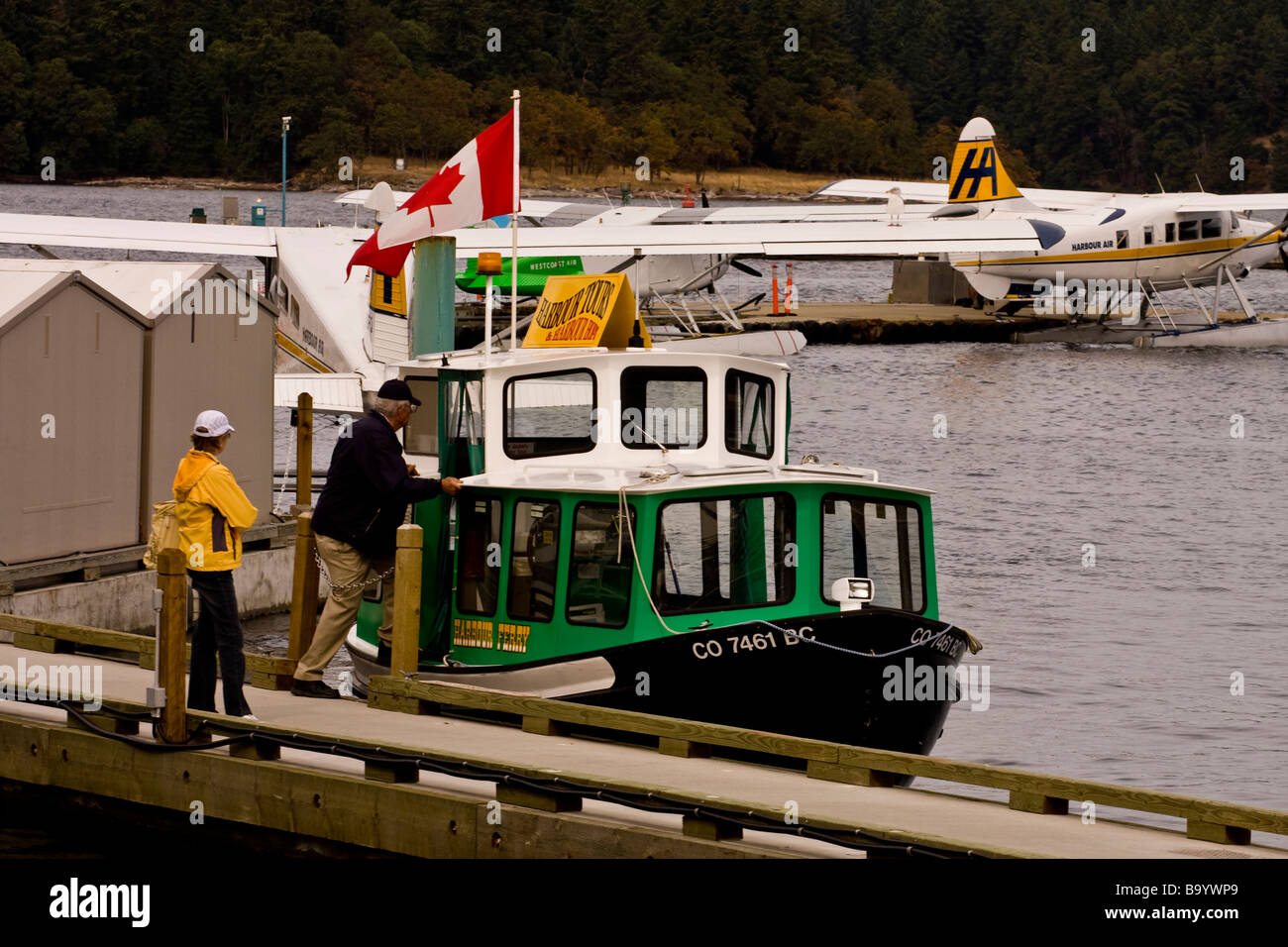 Green Ferry and Seaplane Stock Photo - Alamy