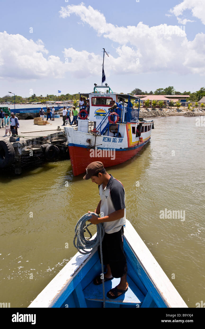 Man working the ferry pulling into San Jorge on Lake Nicaragua ...