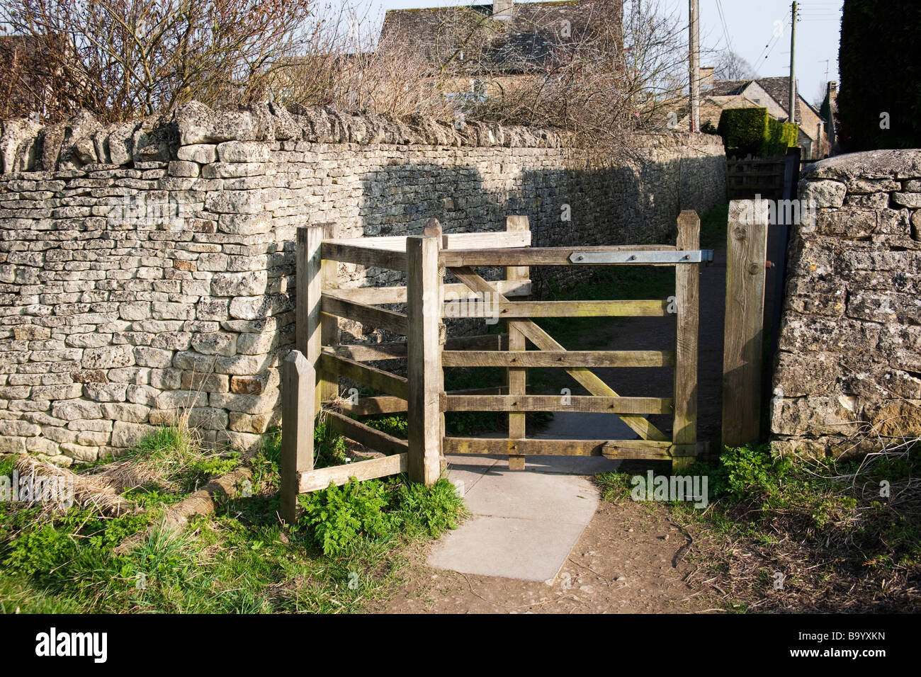 gate and stile on the cotswolds way footpath Lower Slaughter Village ...