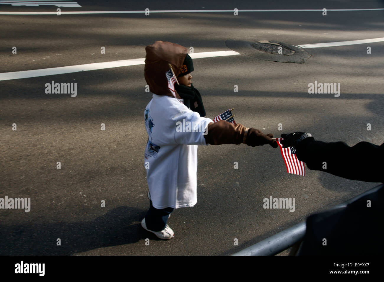 Boy handing out US flags on the annual Veterans Day Parade 5th Avenue ...