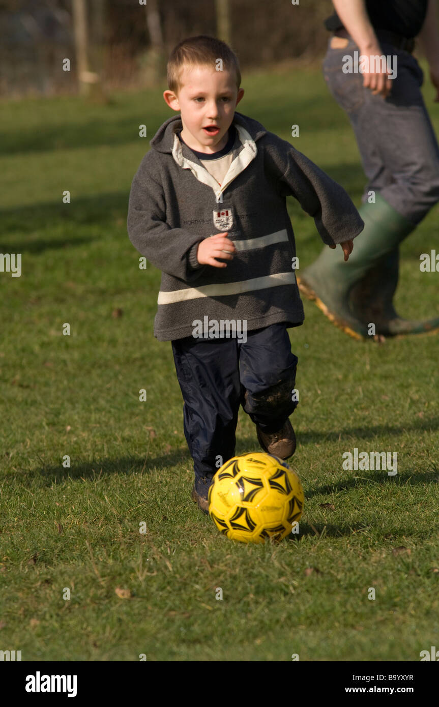 Children playing football uk hi-res stock photography and images - Alamy