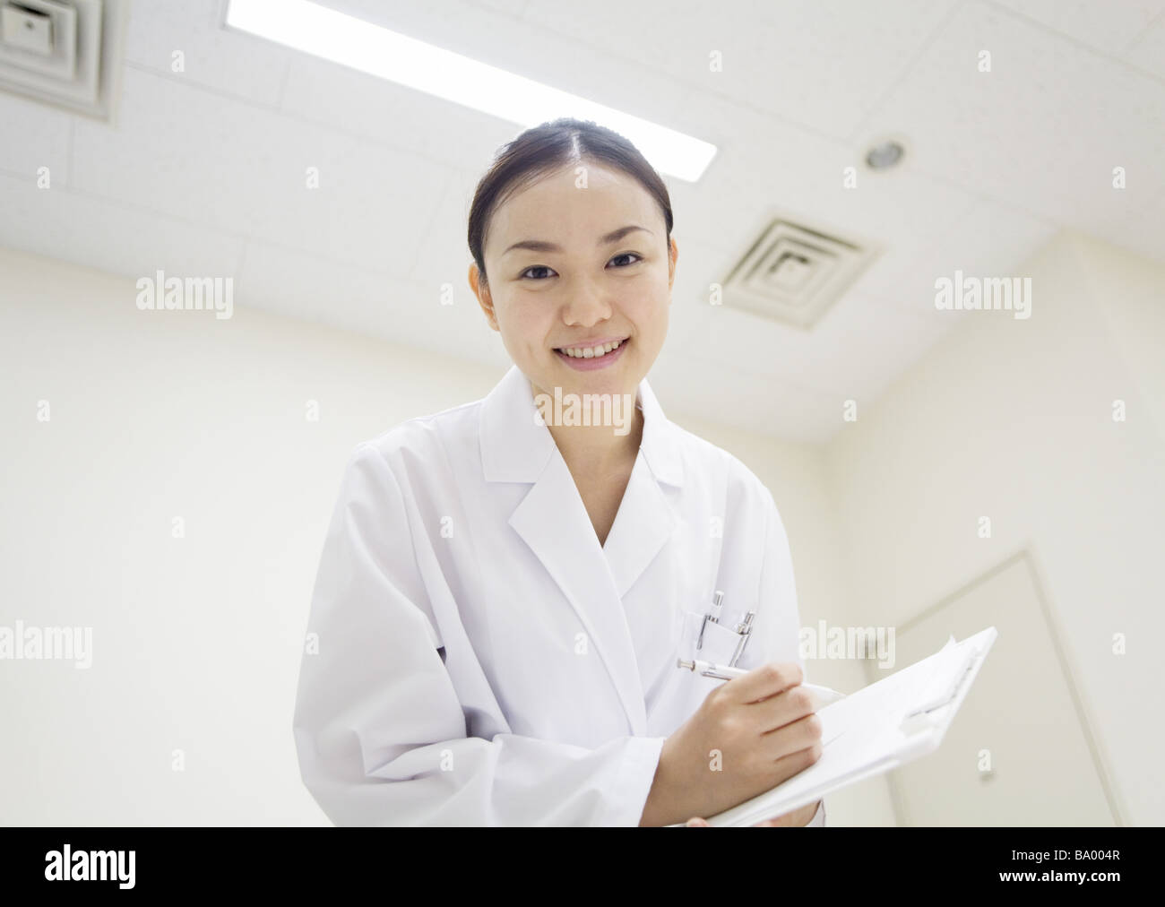 A smiling medical technologist Stock Photo - Alamy