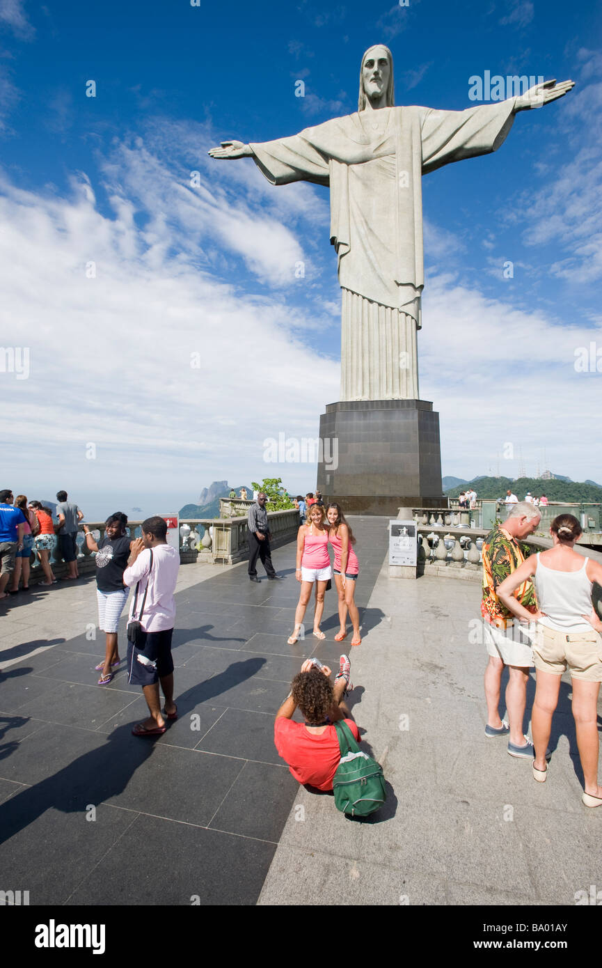 RIO DE JANEIRO BRAZIL. TOURISTS TAKE PICTURES ON CORCOVADO HILL BELOW ...