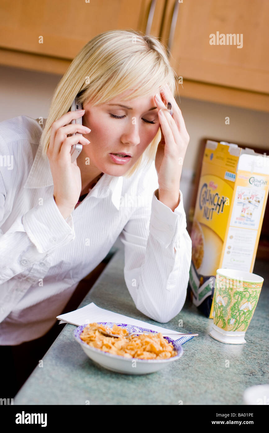 Woman stressed talking on mobile phone Stock Photo - Alamy