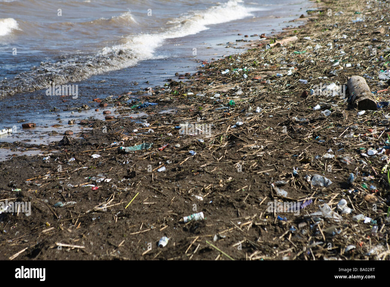Shore littered with trash and debris Stock Photo - Alamy