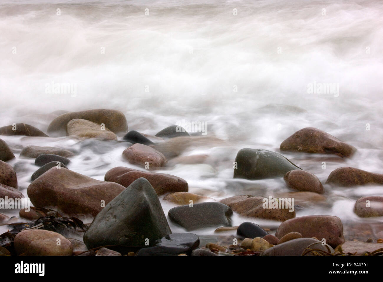 Water washing over rocks Stock Photo - Alamy