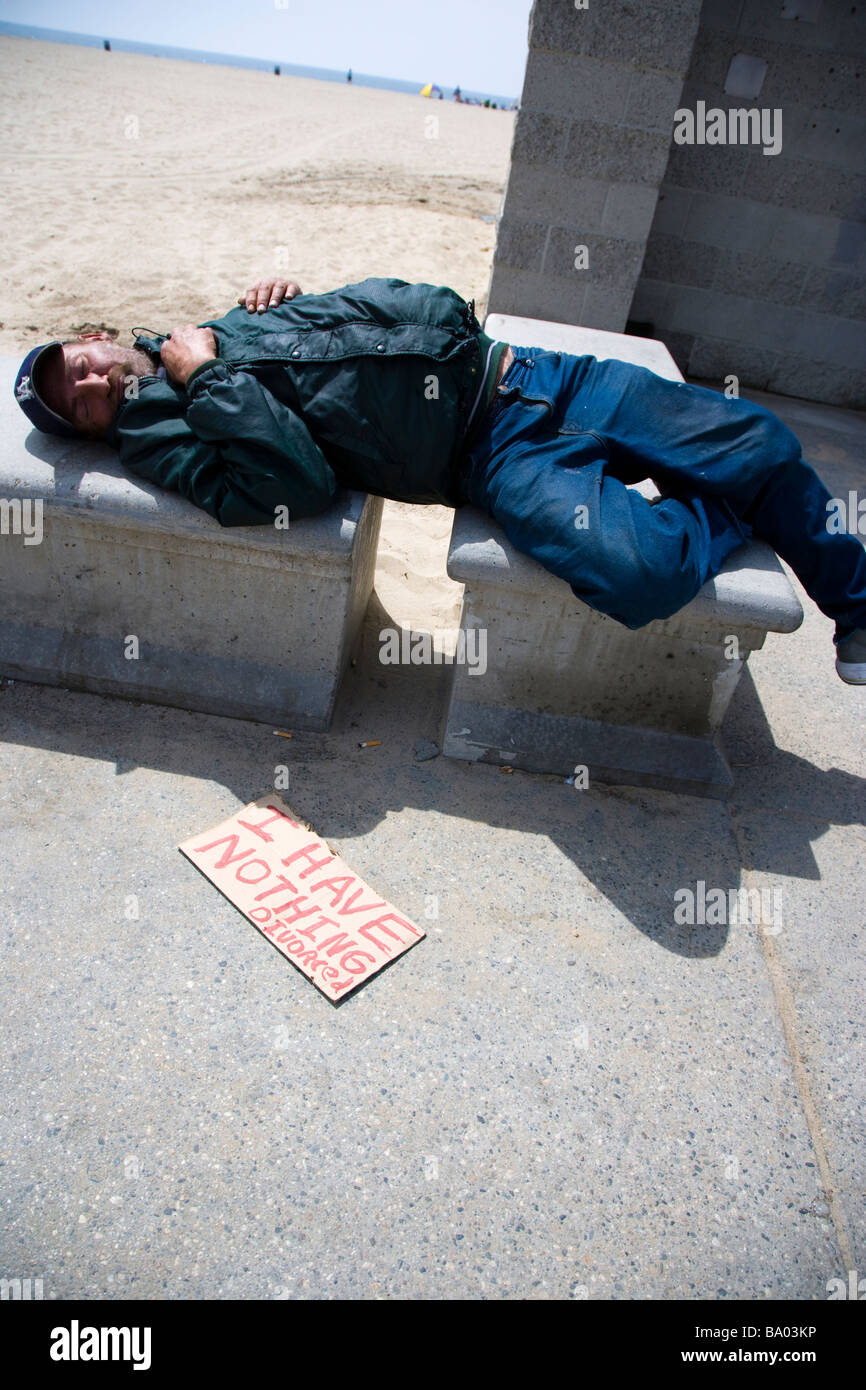 Homeless man lying down with sign I Have Nothing Divorce Venice Los ...